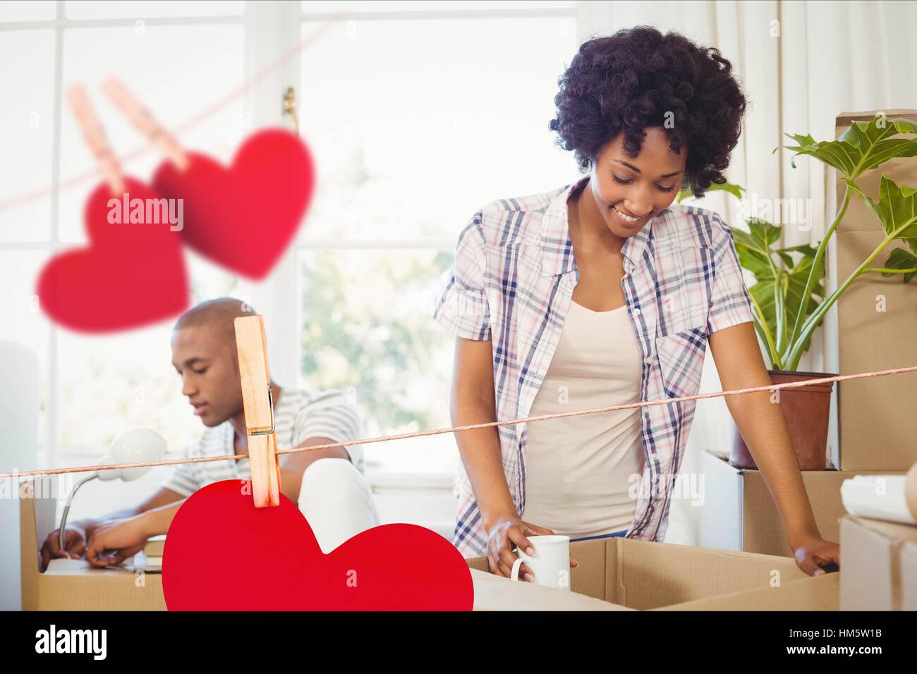 Unpacking cardboard boxes hi-res stock photography and images - Alamy