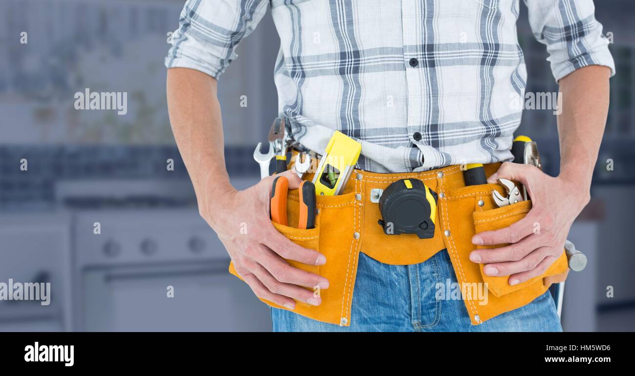 Mid-section of handy man with tool belt Stock Photo - Alamy