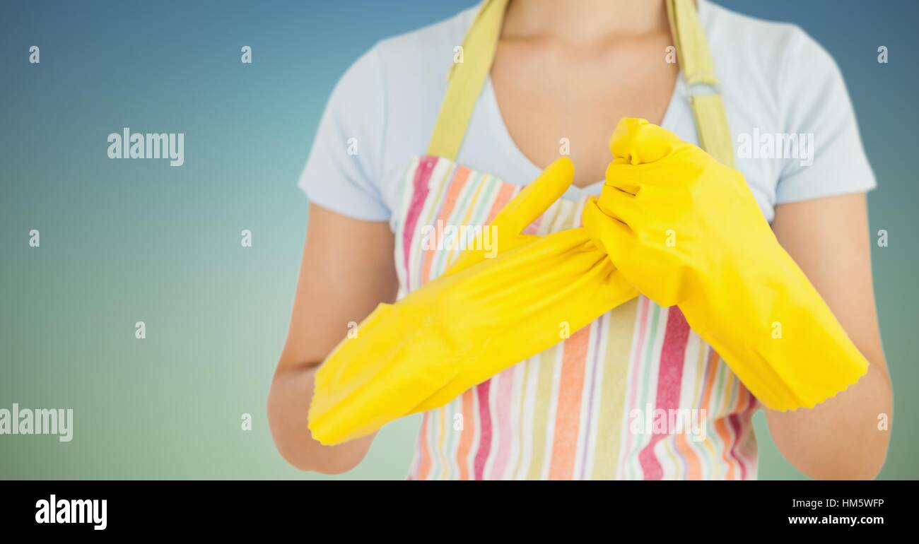Female cleaner wearing apron and rubber gloves Stock Photo - Alamy