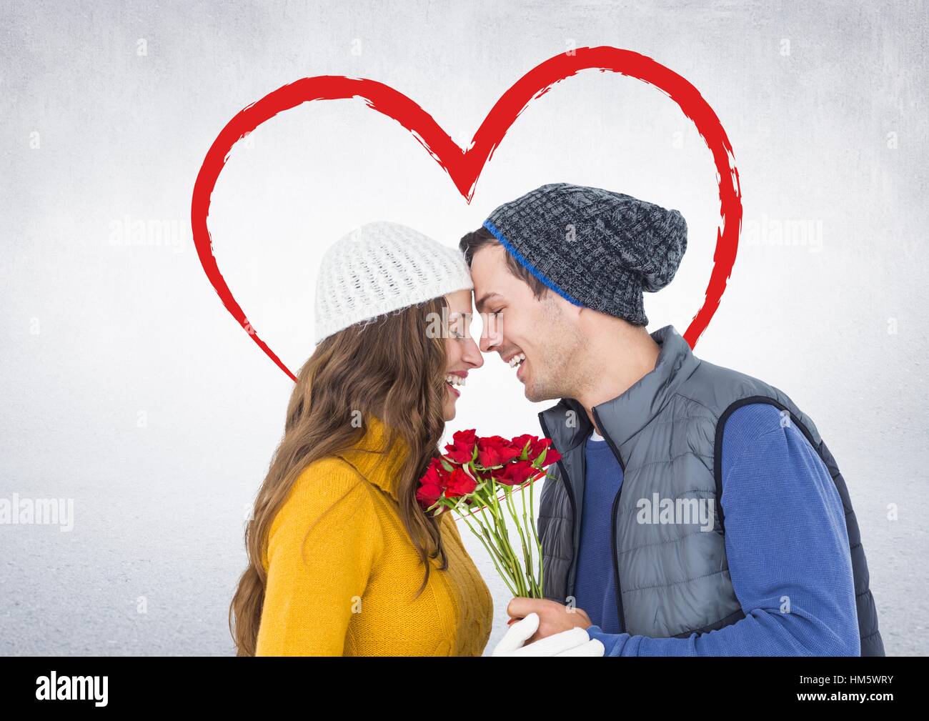 Romantic couple with face to face holding roses Stock Photo - Alamy