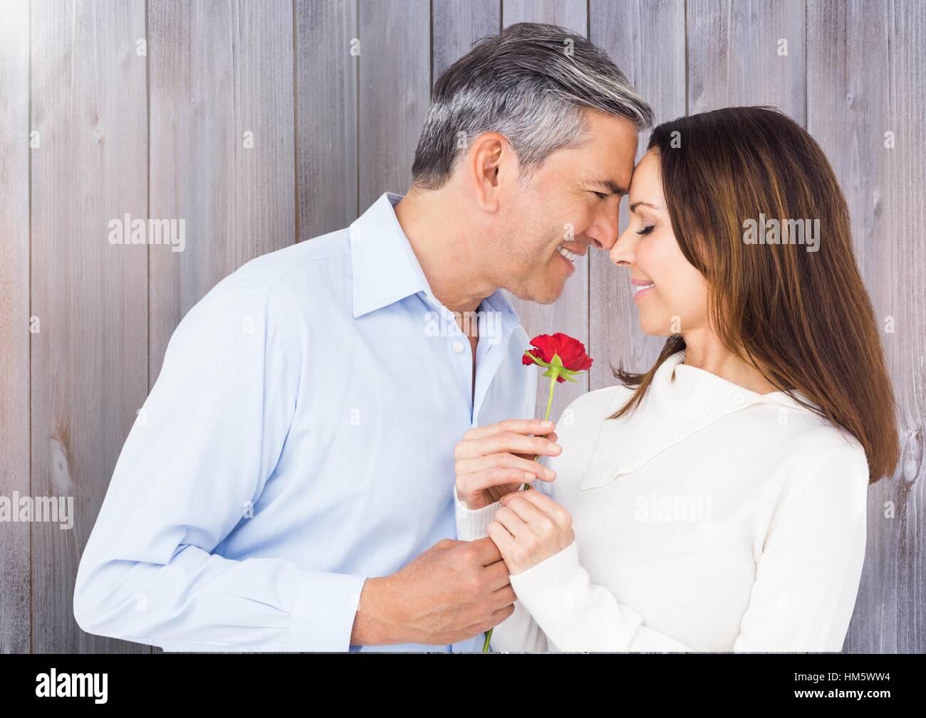 Man giving woman white rose hi-res stock photography and images - Alamy