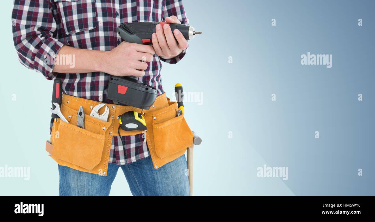 Mid section of handy man with tool belt holding a drill Stock Photo - Alamy