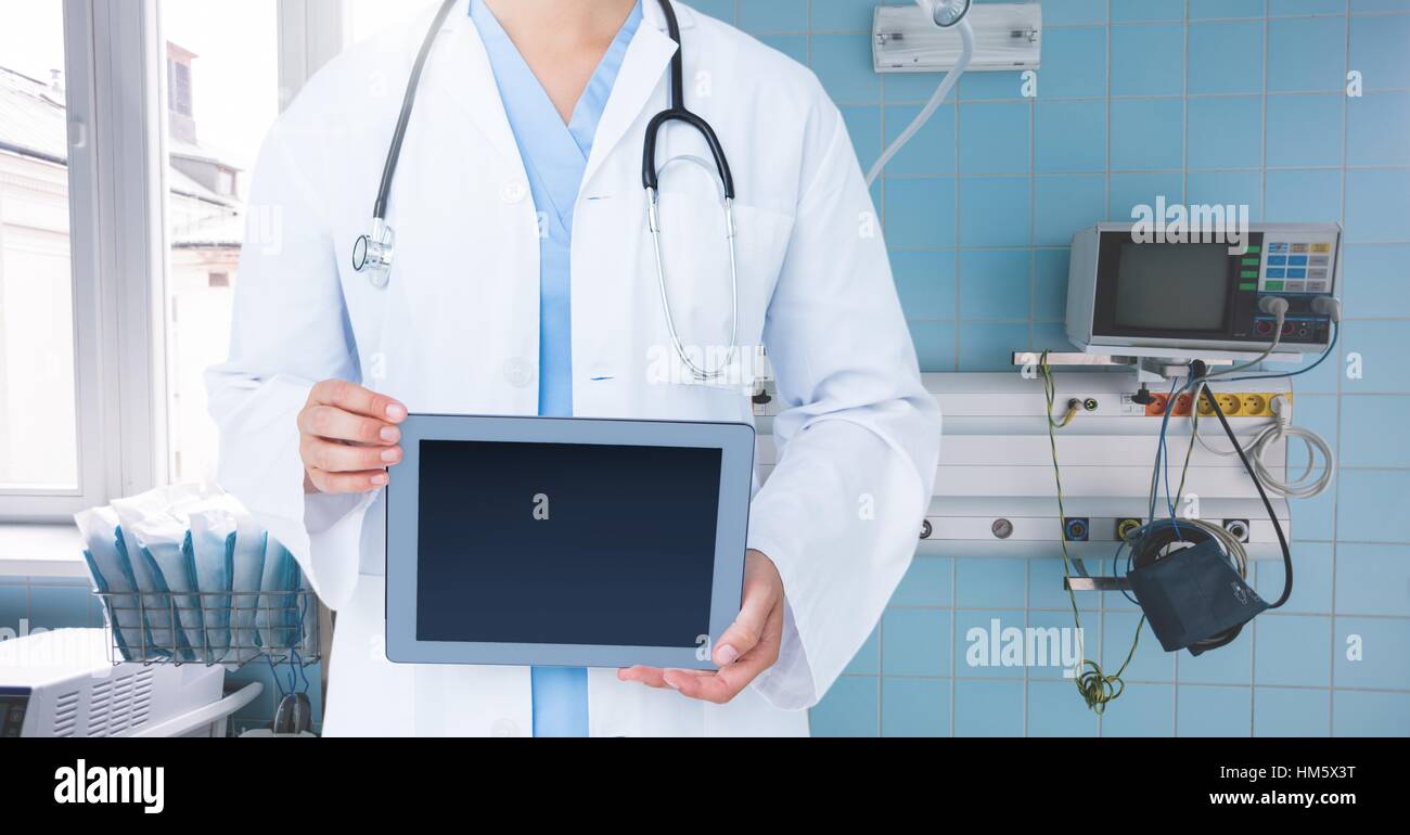 Mid section of doctor standing with digital tablet Stock Photo - Alamy