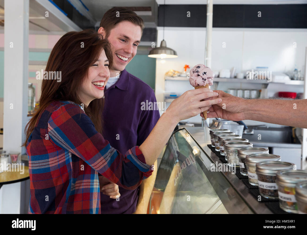 Giving an ice cream hi-res stock photography and images - Alamy
