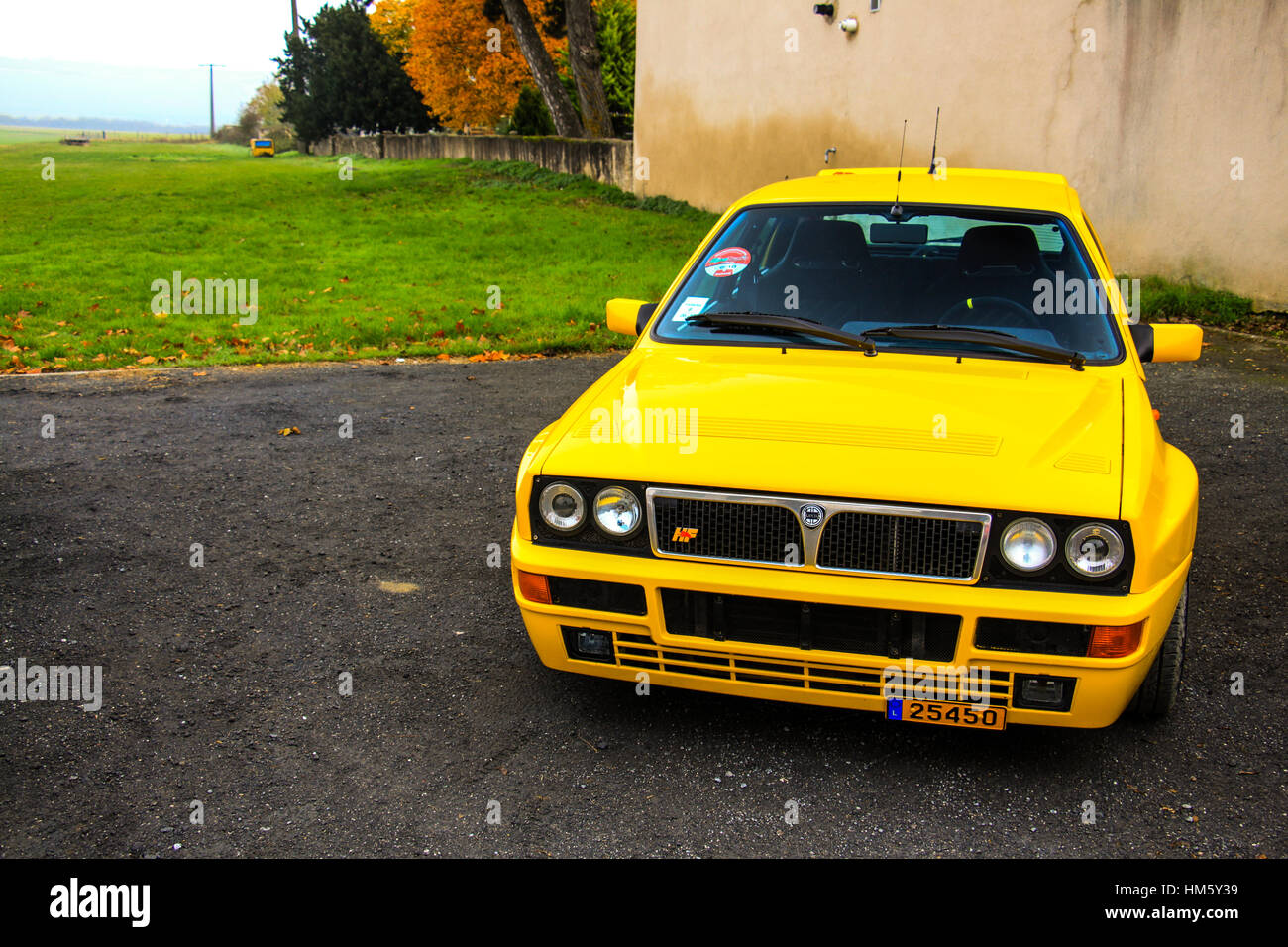 Yellow Lancia Delta HF Integrale Evoluzione Stock Photo - Alamy