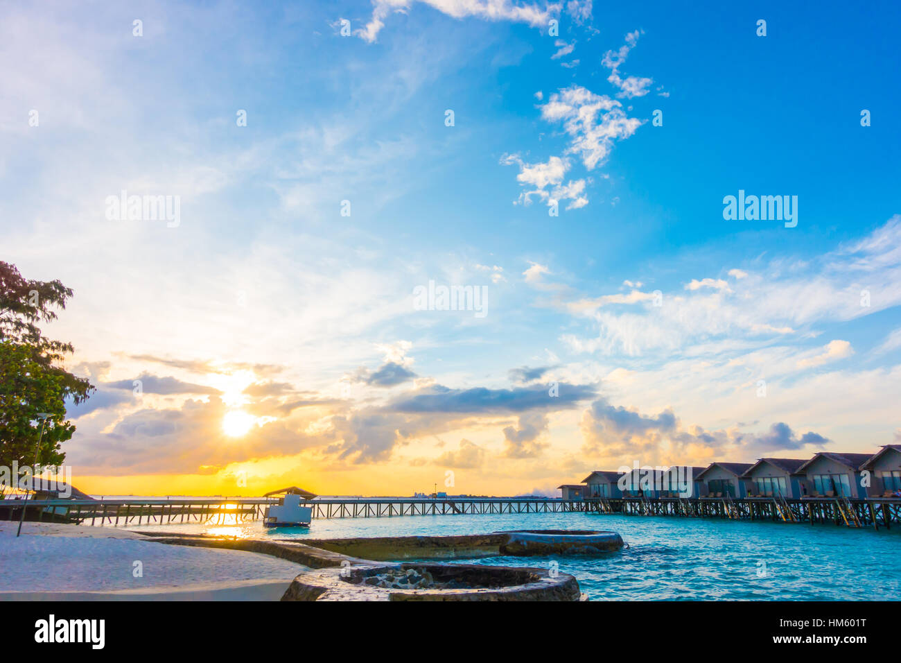 Beautiful sunrise with water villas in tropical Maldives island Stock ...