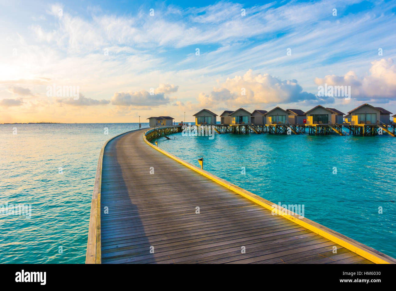 Beautiful sunrise with water villas in tropical Maldives island Stock ...