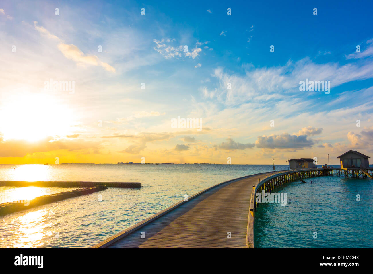 Beautiful sunrise with water villas in tropical Maldives island Stock ...