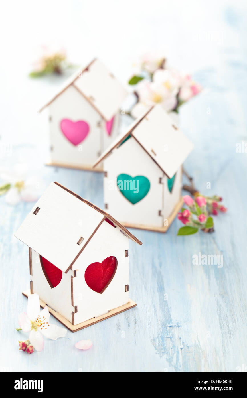 White wooden houses with colorful heart shaped windows Stock Photo - Alamy