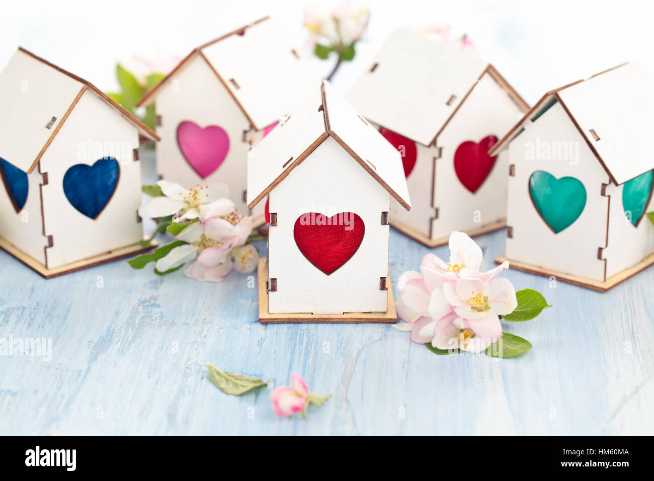 White wooden houses with colorful heart shaped windows Stock Photo - Alamy