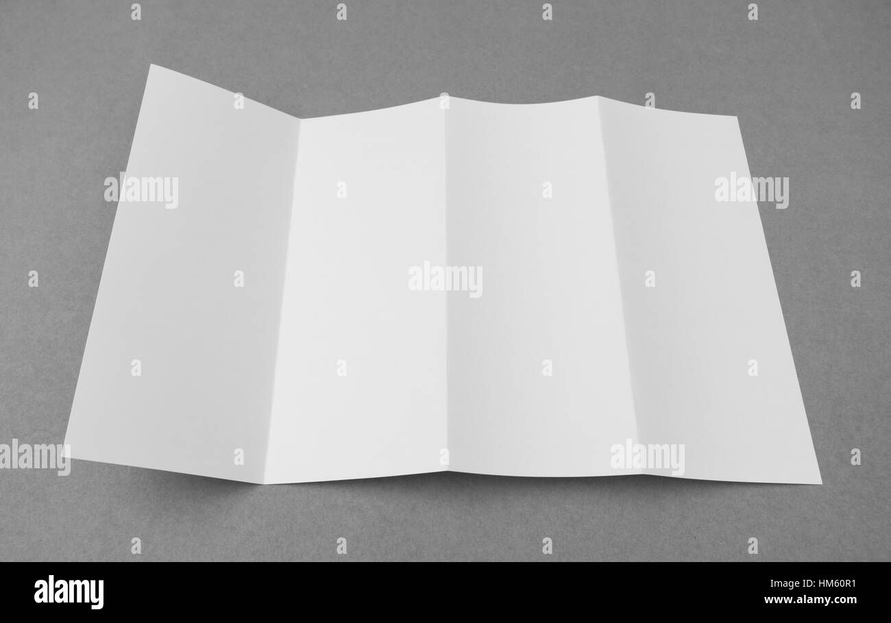 Four - fold white template paper on gray background Stock Photo - Alamy