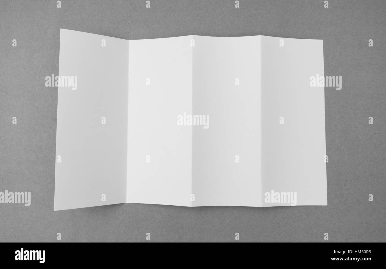 Four - fold white template paper on gray background Stock Photo - Alamy