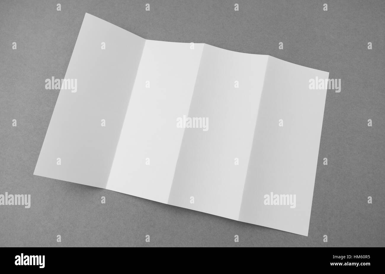 Four - fold white template paper on gray background Stock Photo - Alamy