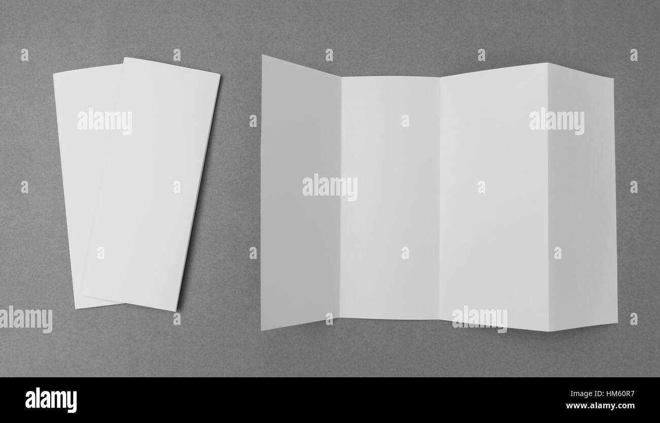 Four - fold white template paper on gray background Stock Photo - Alamy