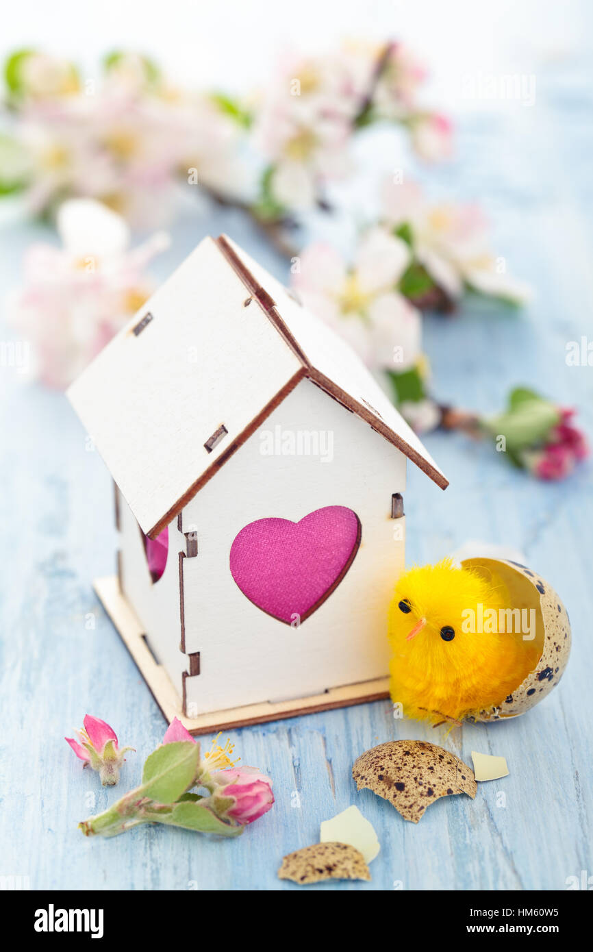 White Wood houses with colorful heart shaped windows Stock Photo - Alamy