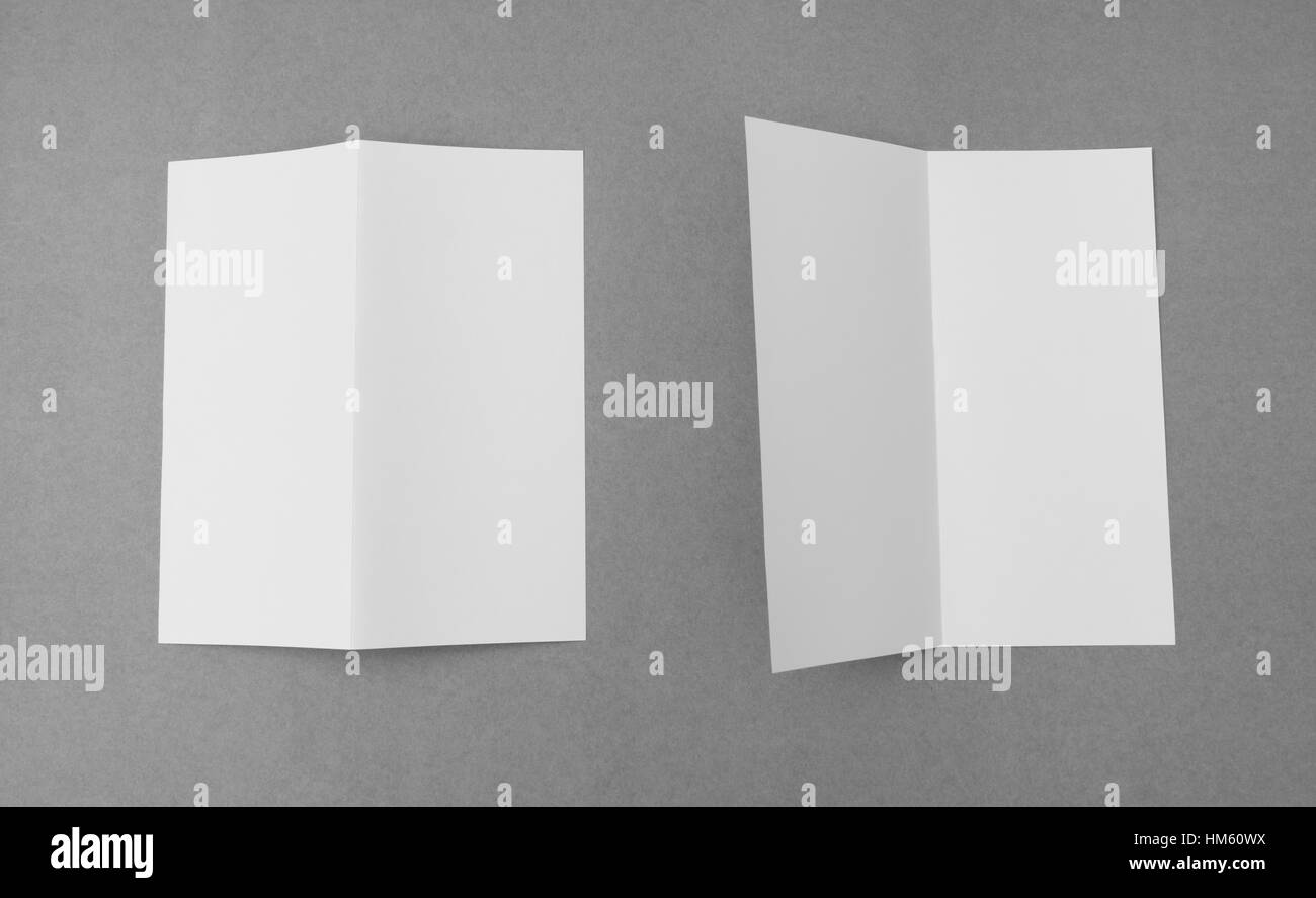 Bifold white template paper on gray background Stock Photo - Alamy