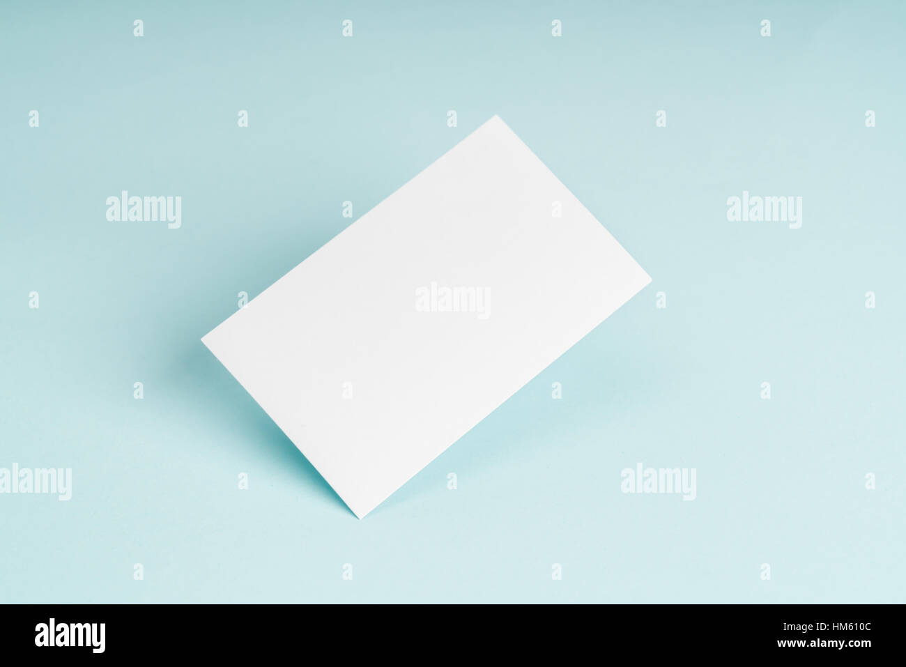 Blank business card on blue background Stock Photo - Alamy