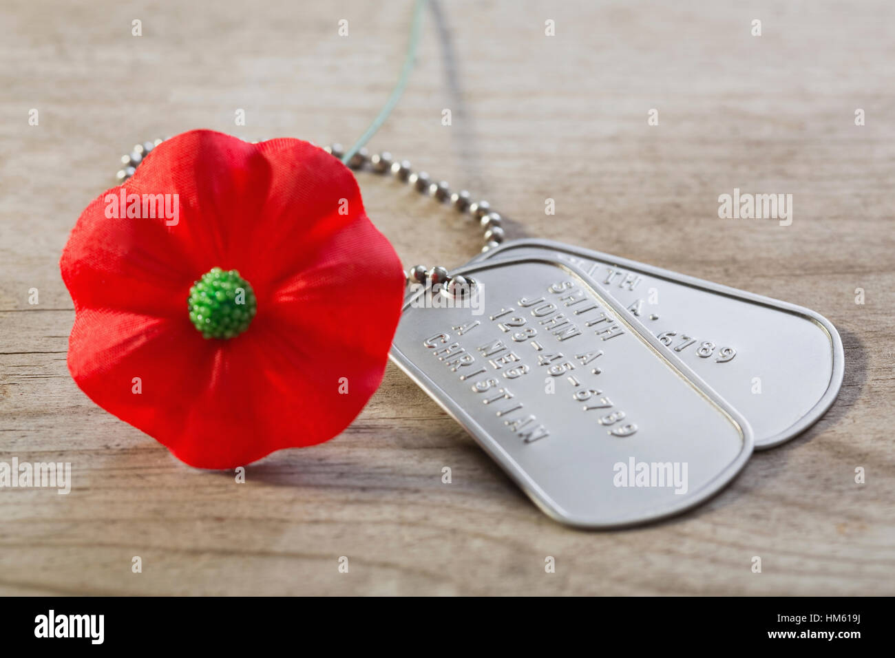 Dog tags and poppy Stock Photo - Alamy