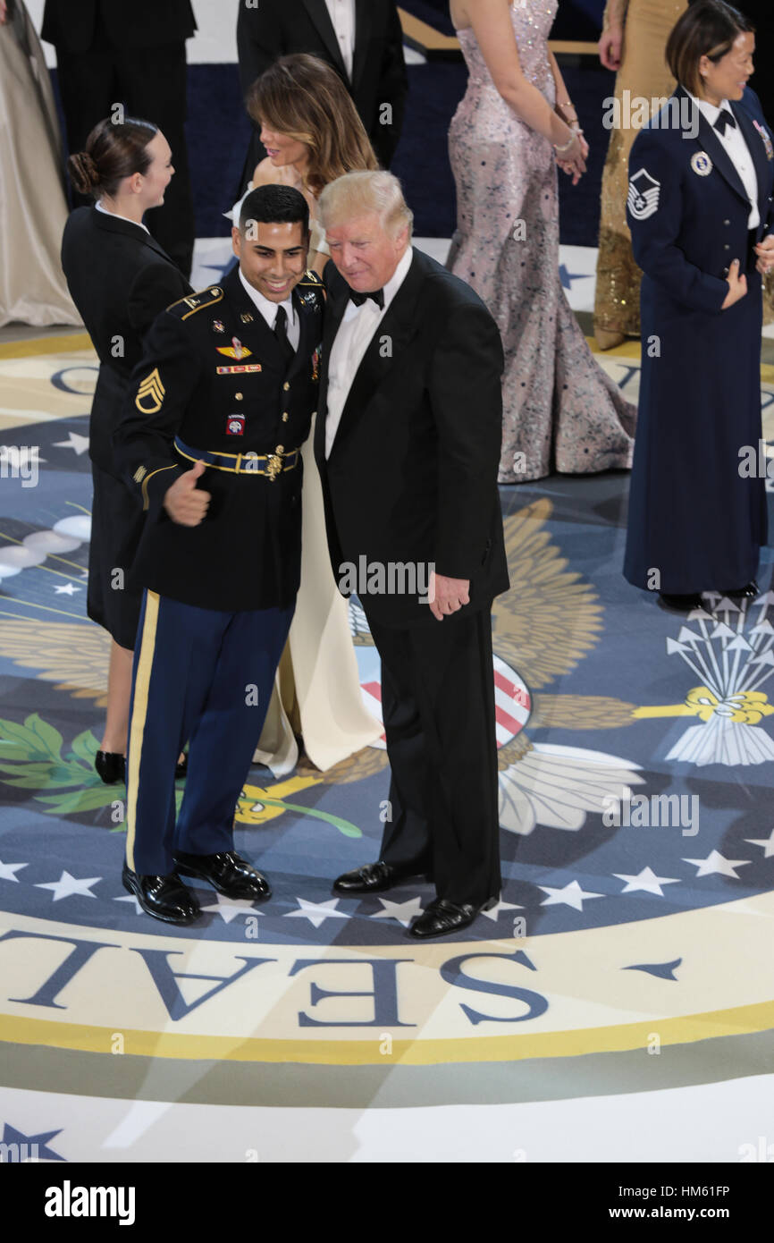 U.S. President Donald Trump poses for a photo with a U.S. soldier ...