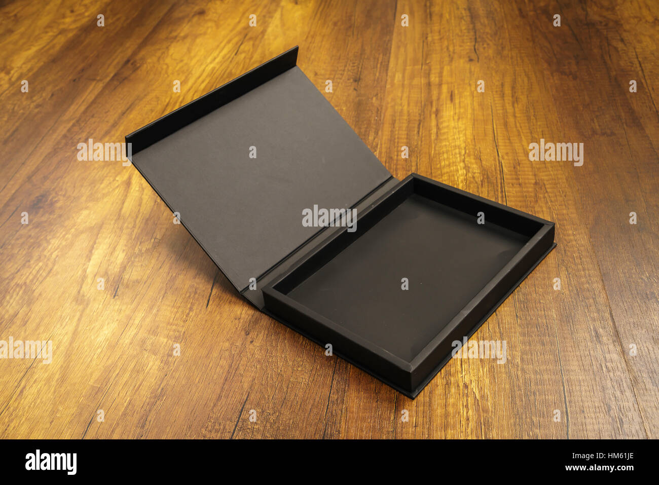 Blank black box mock up on wood background Stock Photo - Alamy