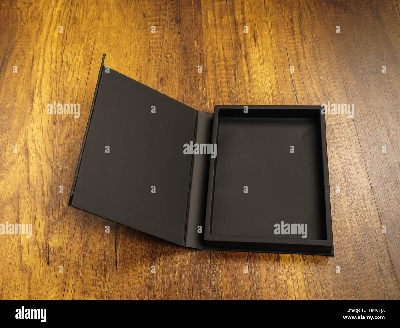Blank black box mock up on wood background Stock Photo - Alamy