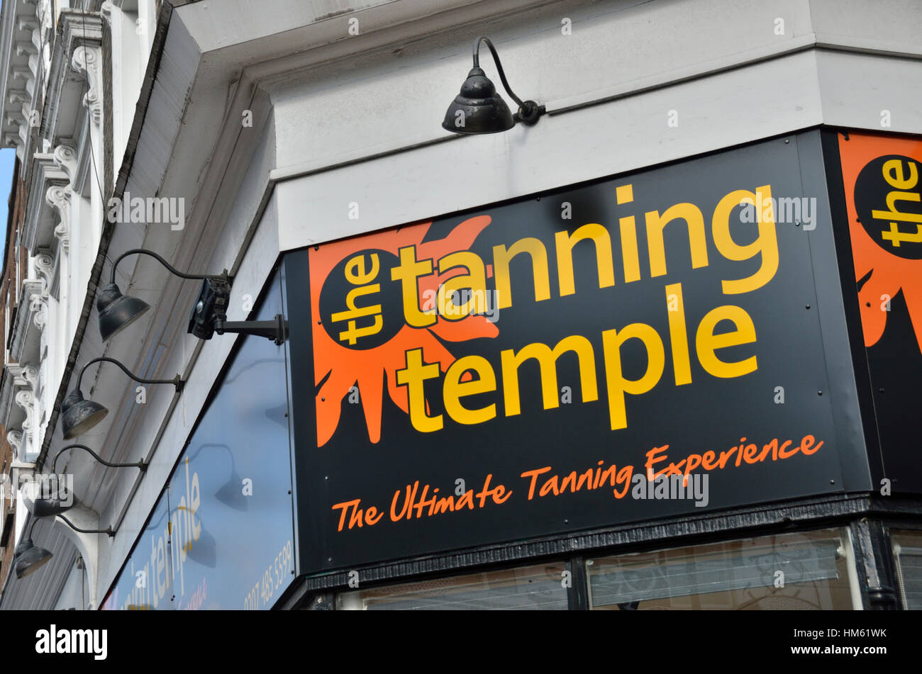 Tanning shop sign Stock Photo - Alamy
