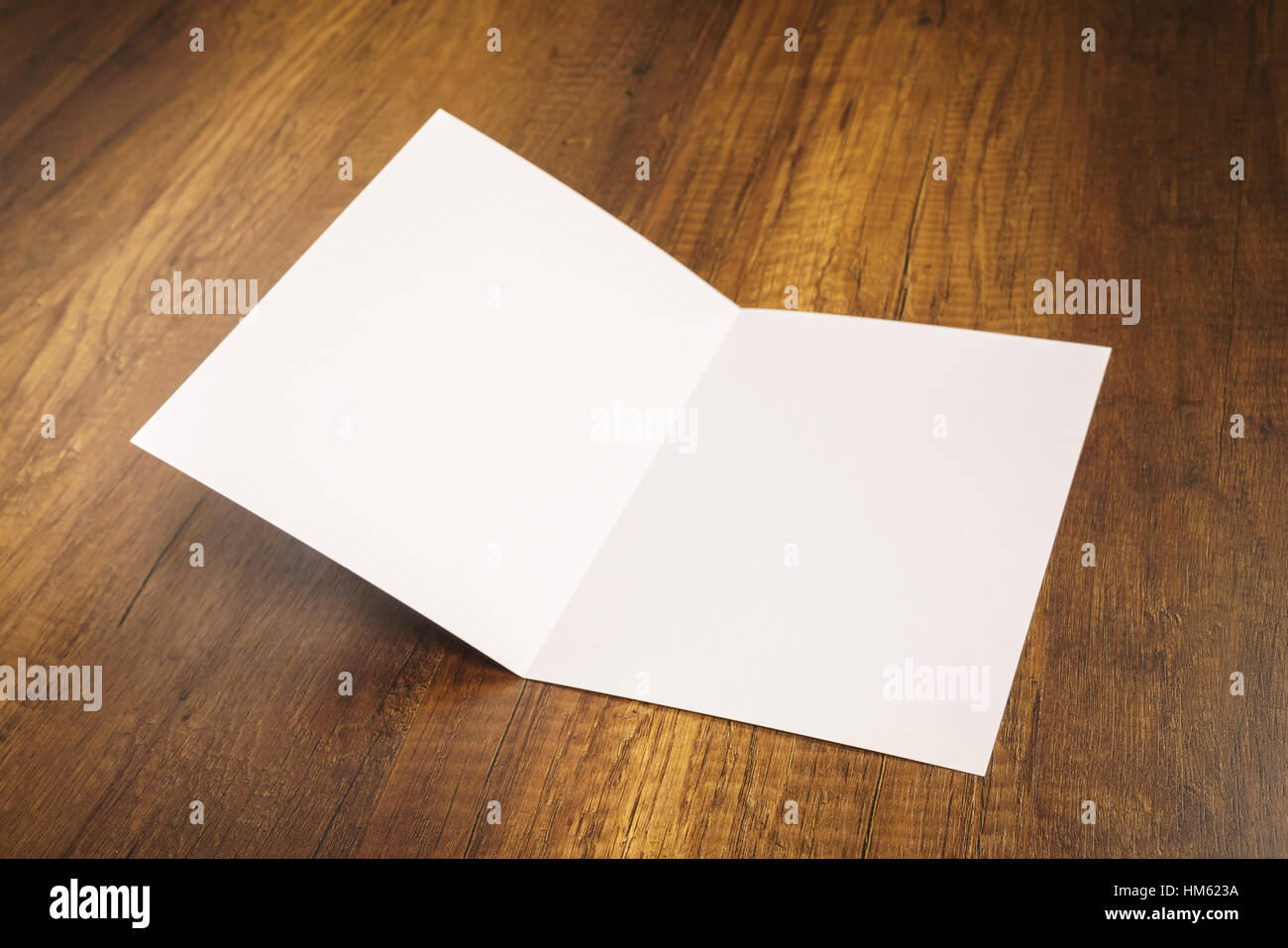 Bifold white template paper on wood texture Stock Photo - Alamy