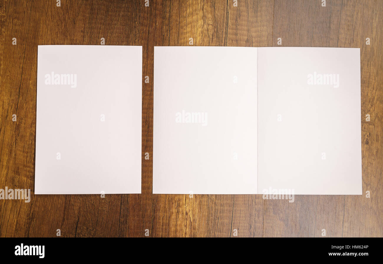 Bifold white template paper on wood texture Stock Photo - Alamy