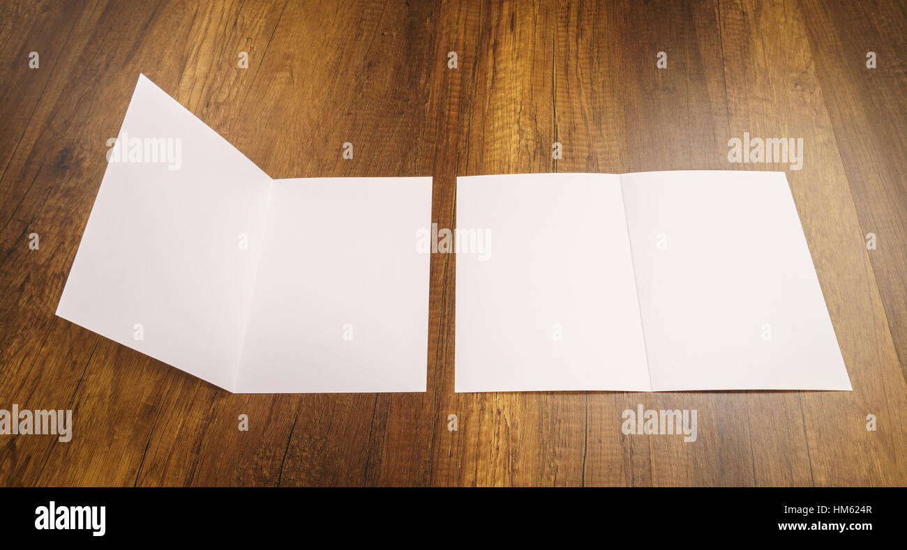 Bifold white template paper on wood texture Stock Photo - Alamy