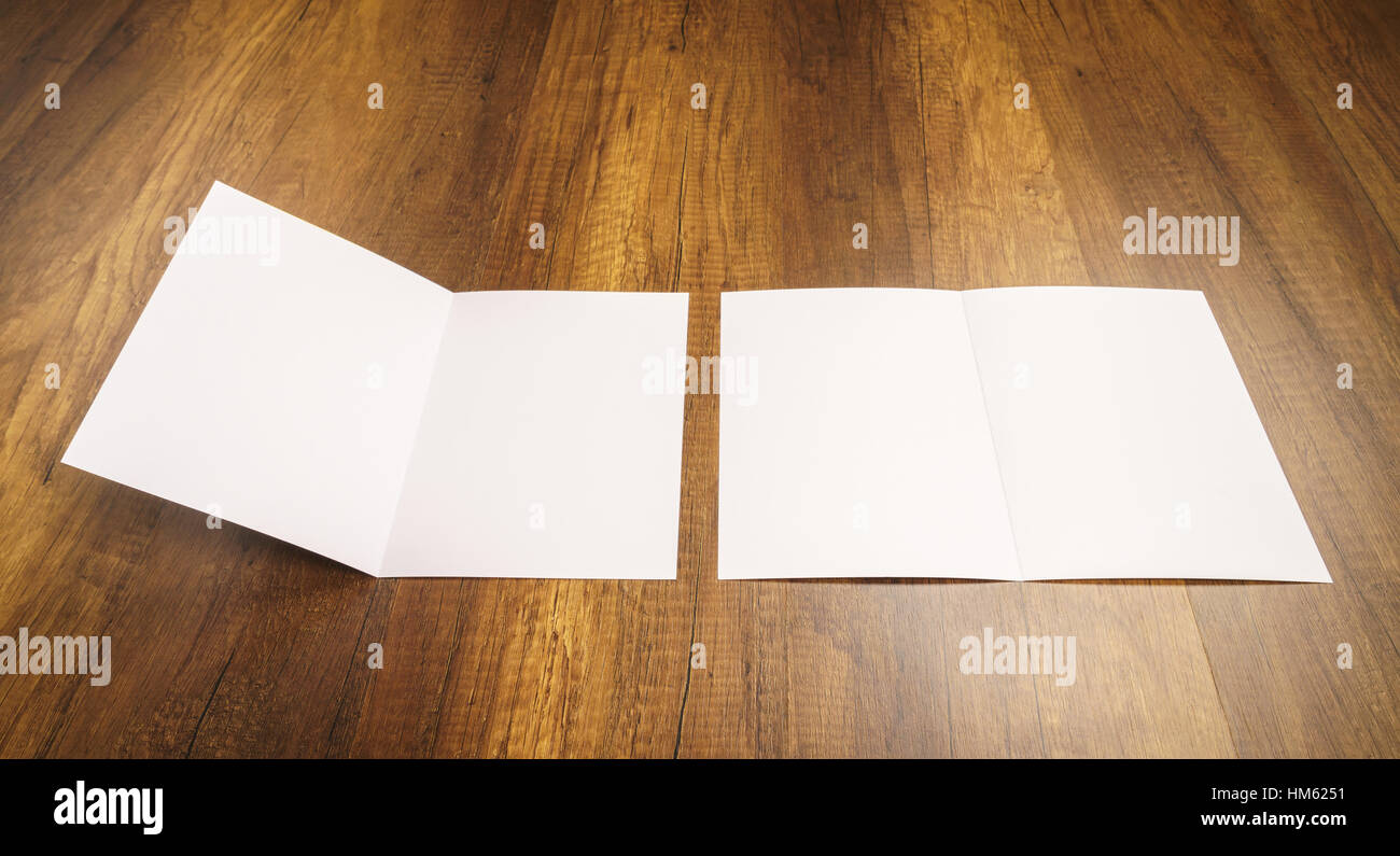 Bifold white template paper on wood texture Stock Photo - Alamy