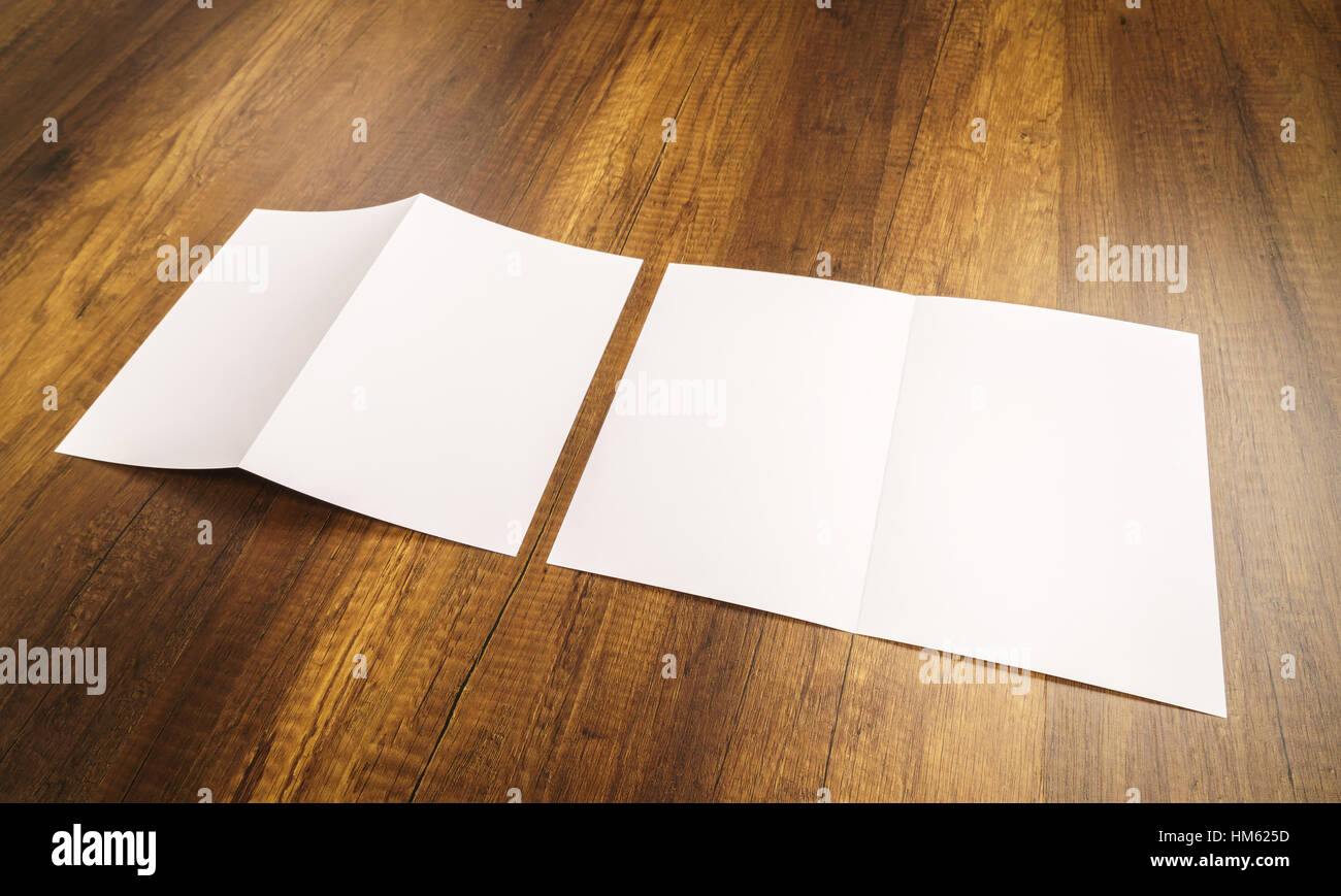 Bifold white template paper on wood texture Stock Photo - Alamy