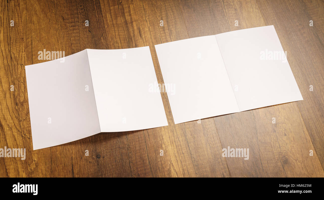Bifold white template paper on wood texture Stock Photo - Alamy