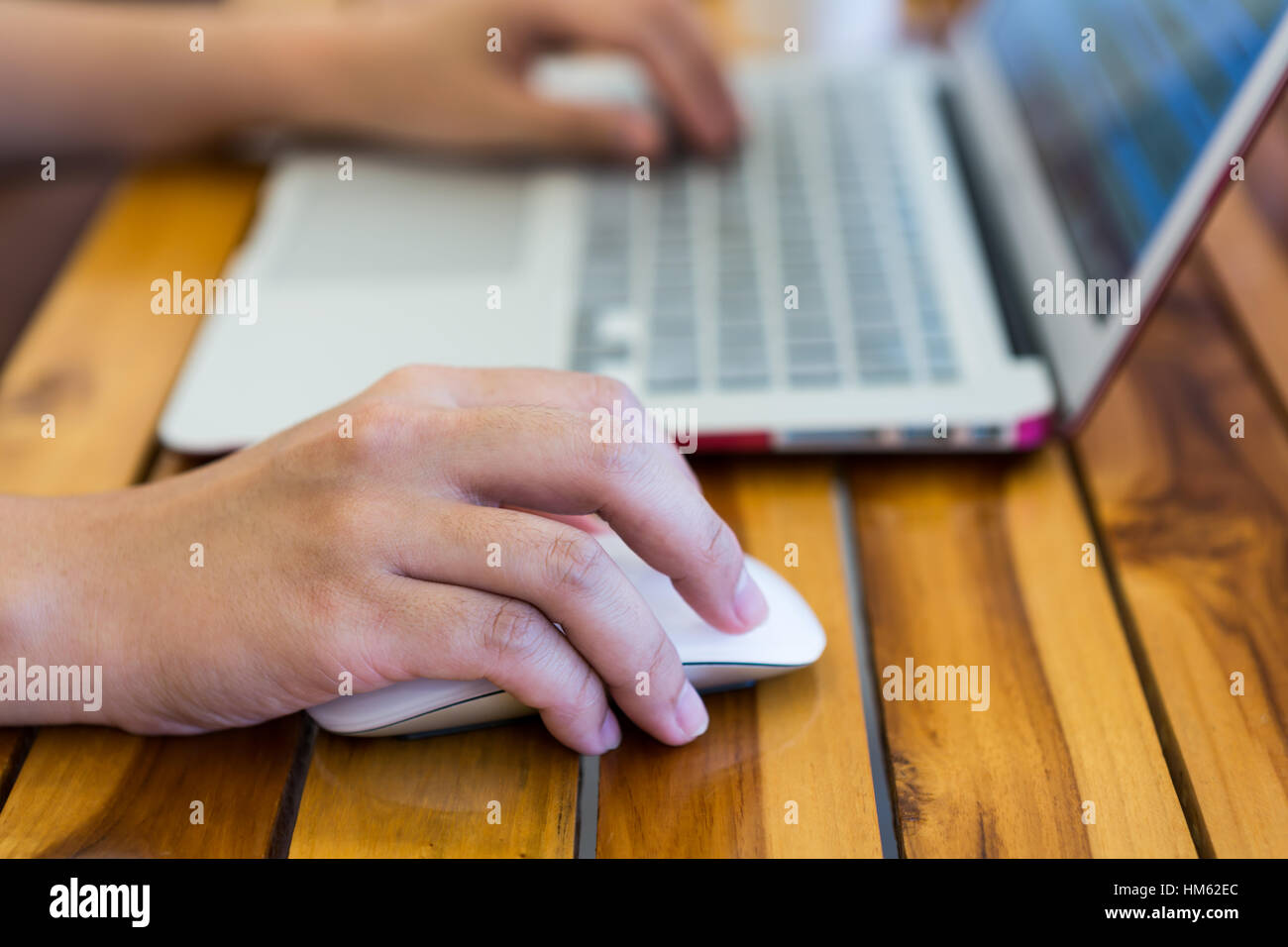 Close-up image of female hand writing on laptot Stock Photo - Alamy