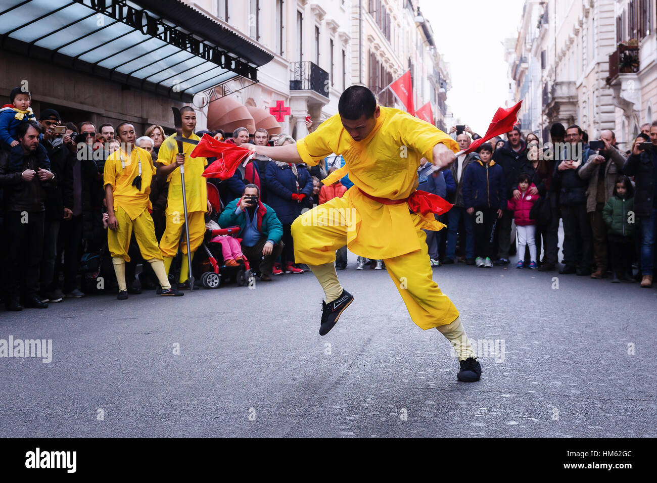 Monk athlete in martial arts, he performs with the sword in the street ...