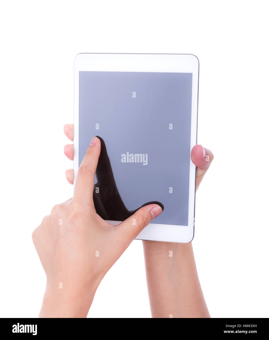 Hand using a touch screen device against white background Stock Photo ...