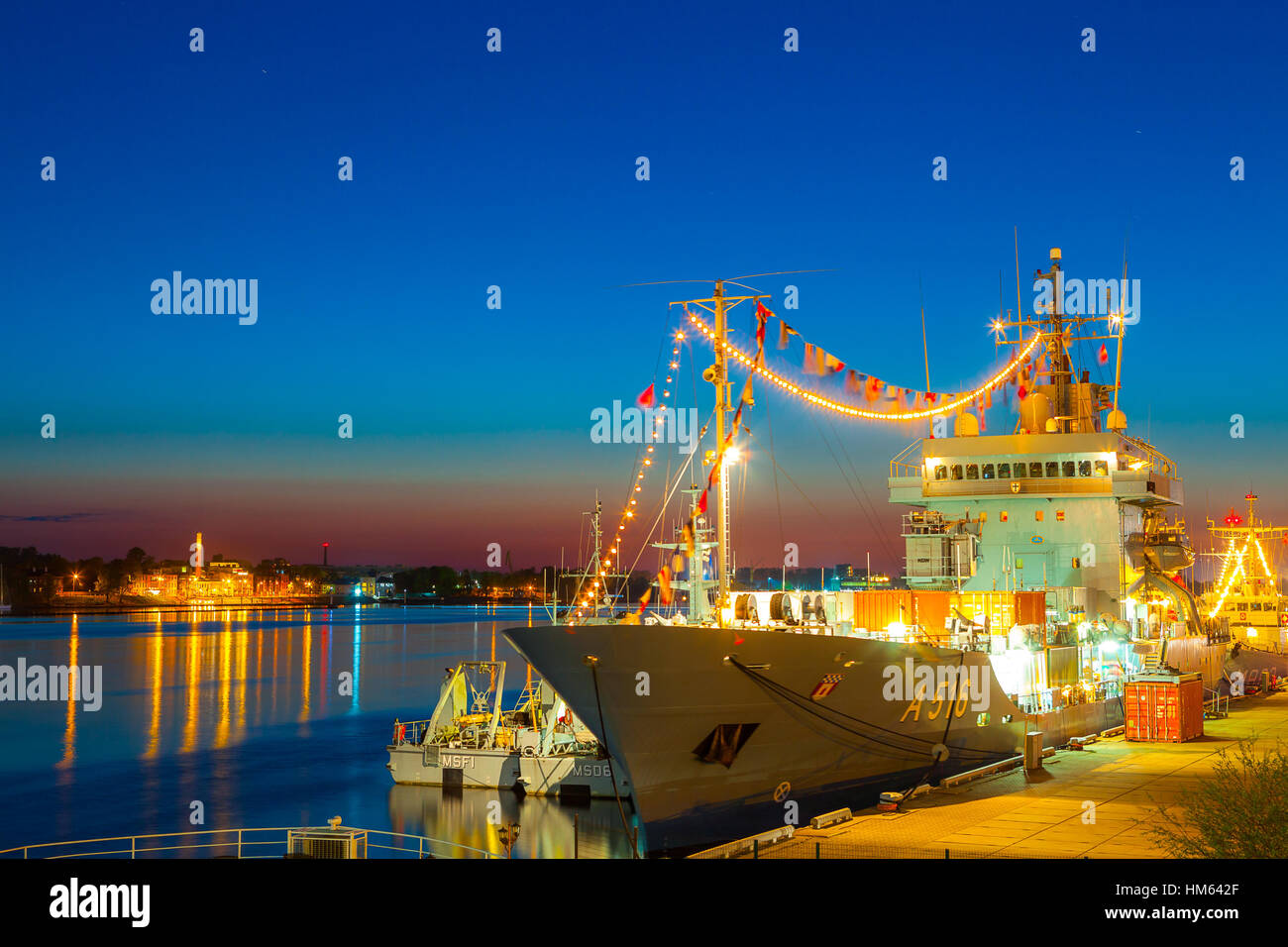 Big motor ship staying near old town of Riga Stock Photo - Alamy