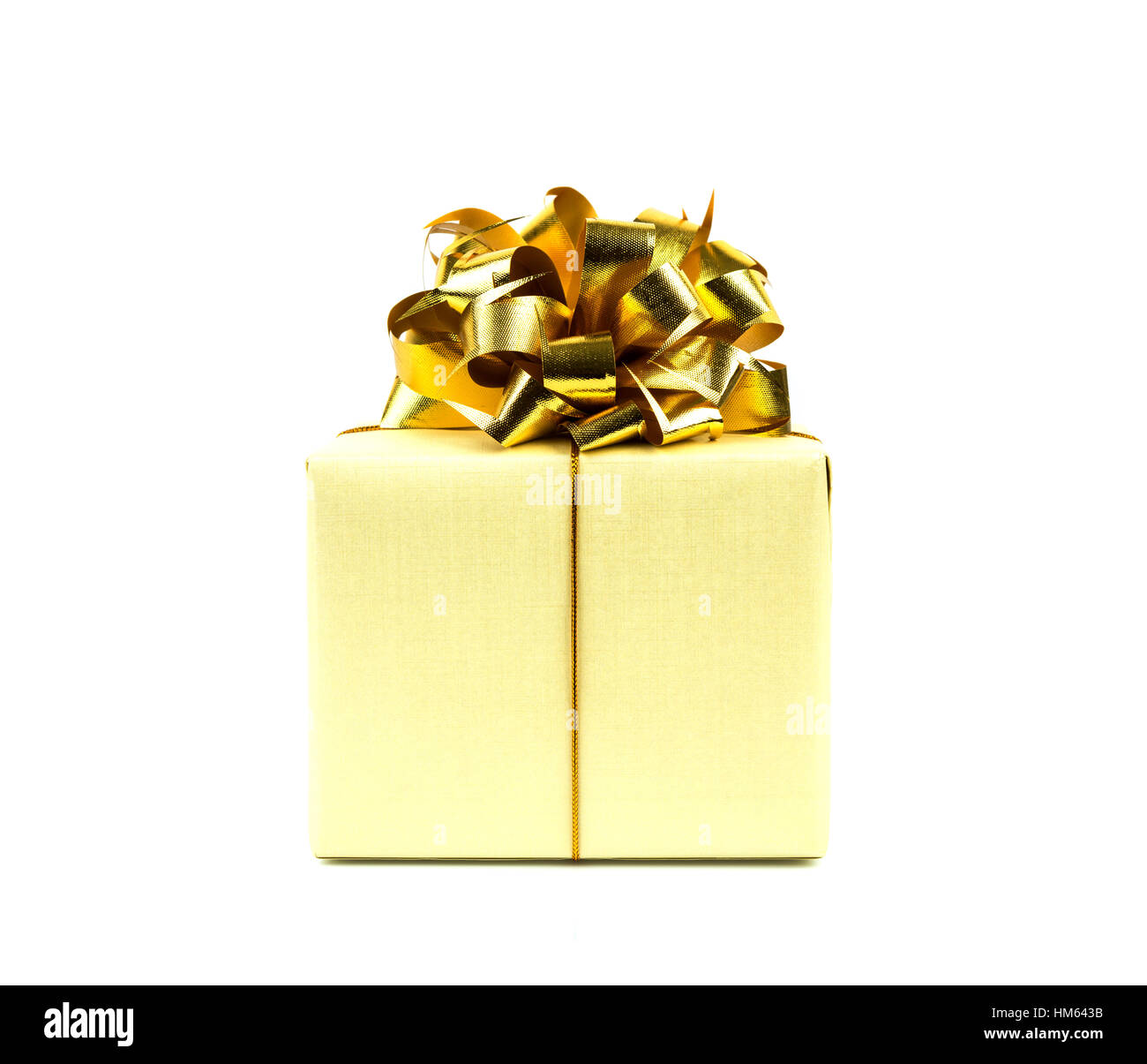 Gold gift box with ribbon on white background Stock Photo - Alamy