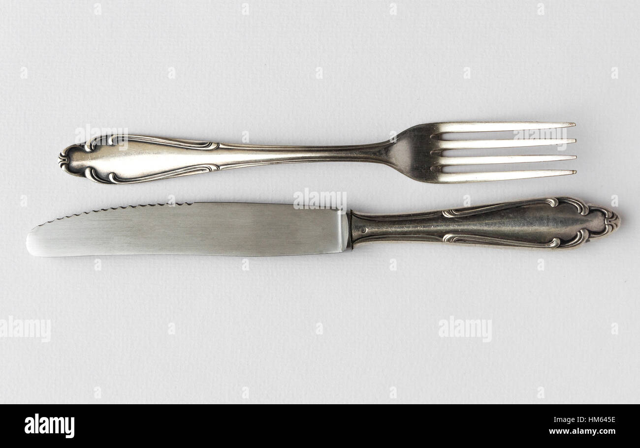 beautiful silver knife and fork isolated on white background Stock ...