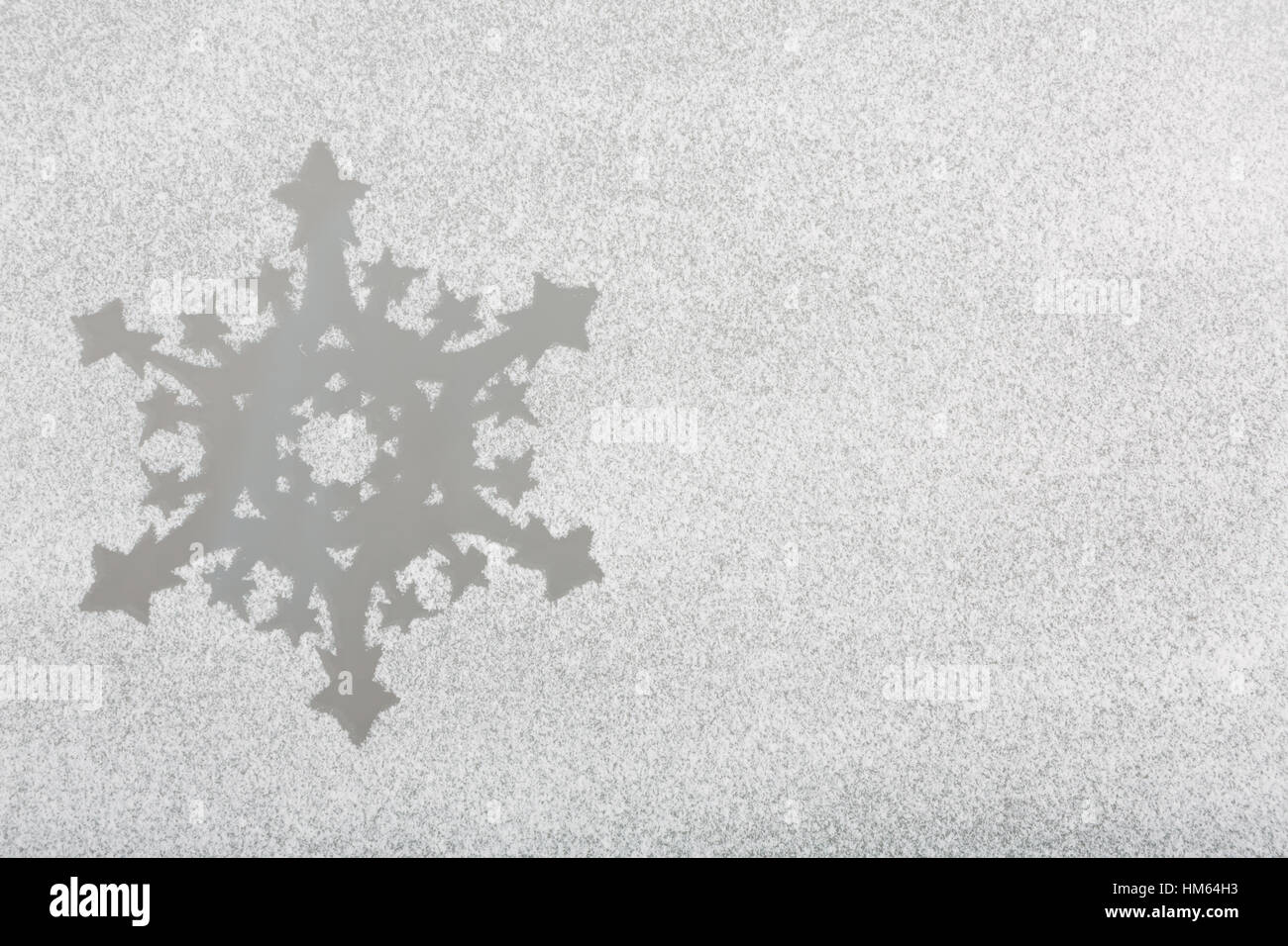 Snow on the frozen window with snowflakes Stock Photo - Alamy