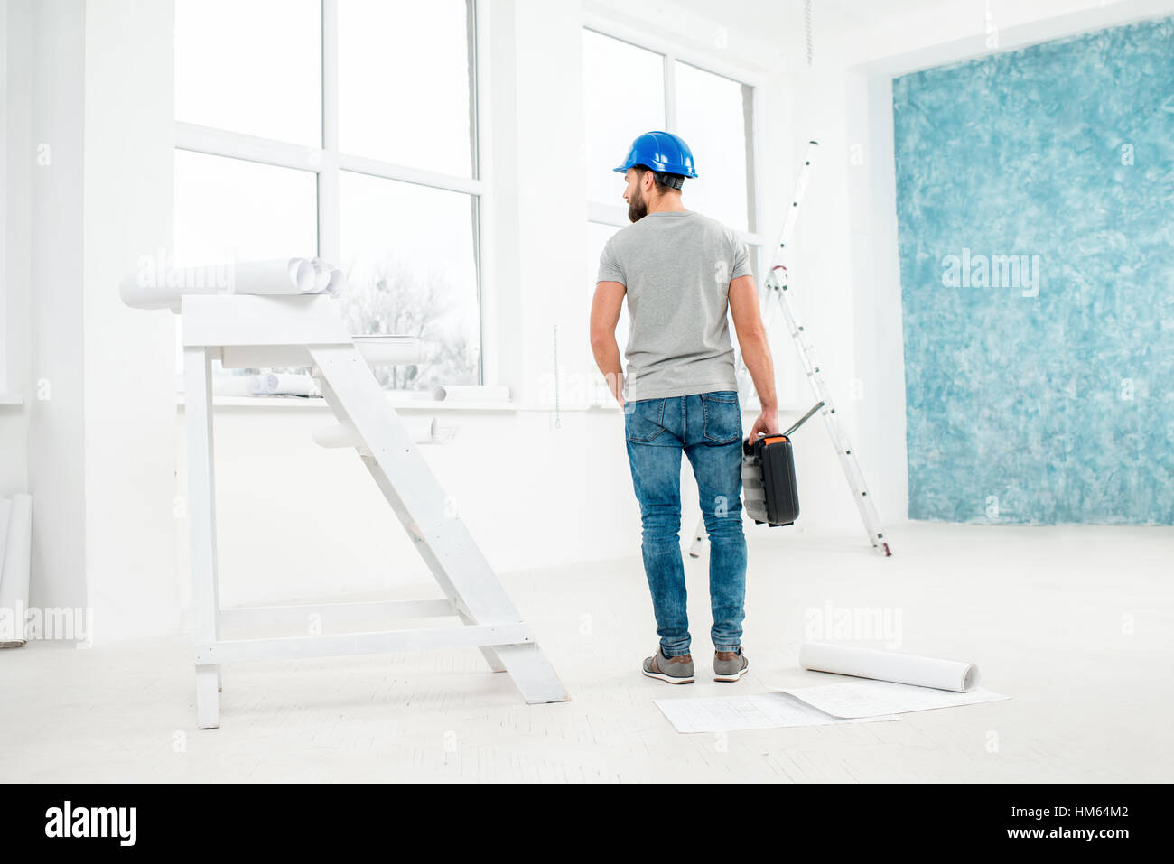 Foreman or worker in the interior Stock Photo - Alamy