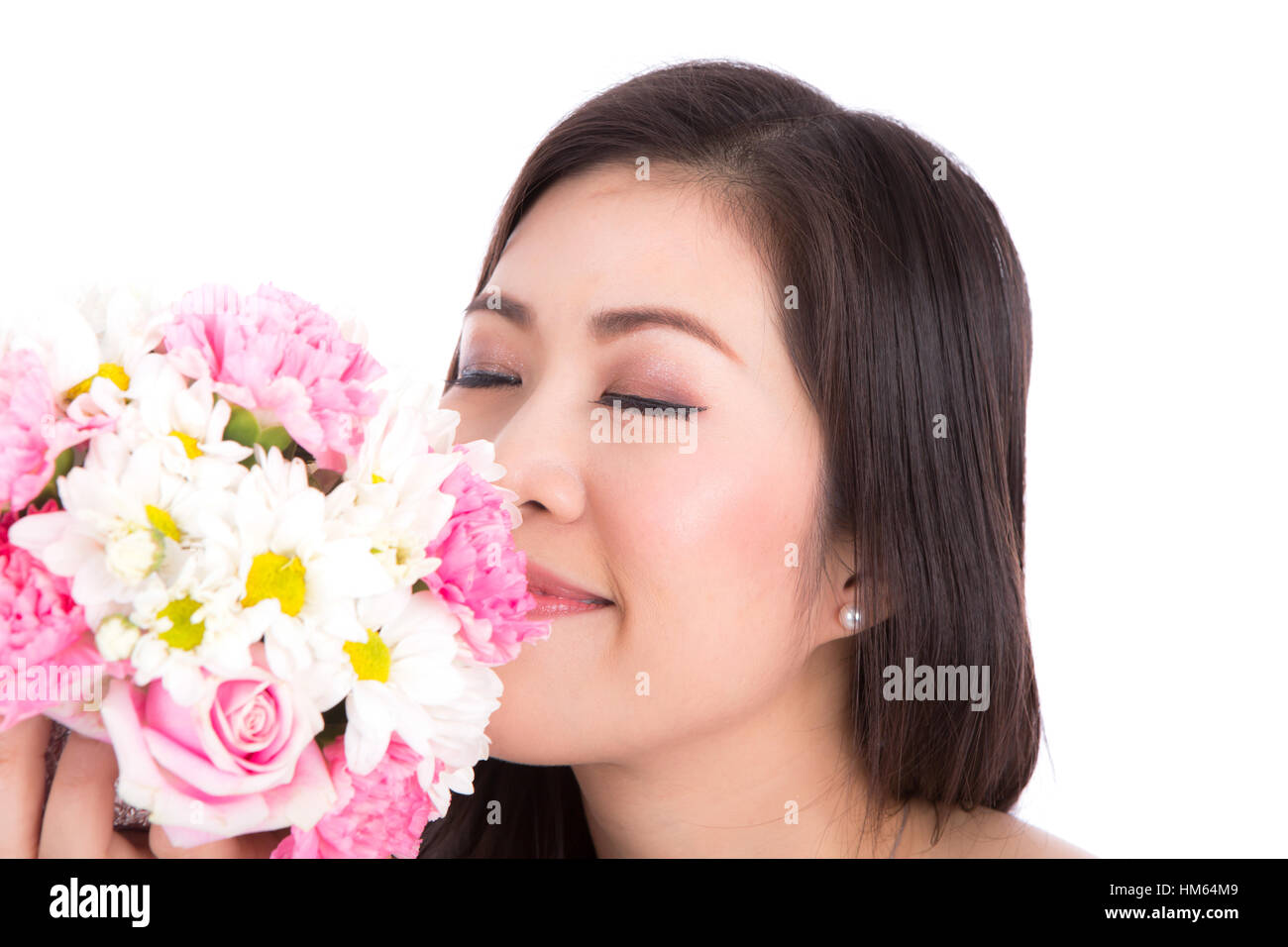 Woman smiling showing flowers isolated on white background Stock Photo ...