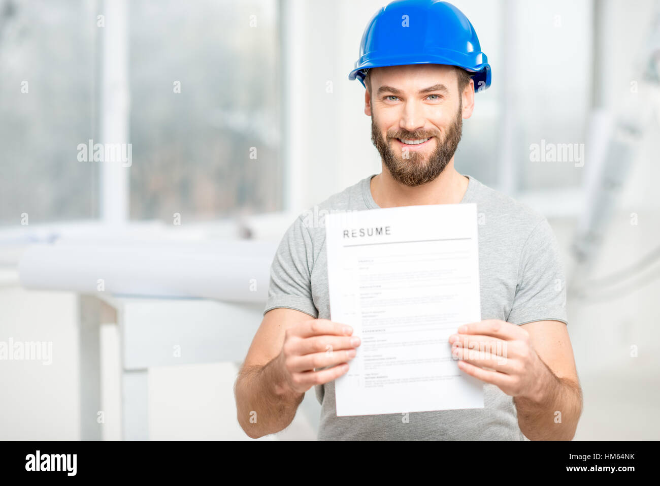 Builder searching a job Stock Photo - Alamy