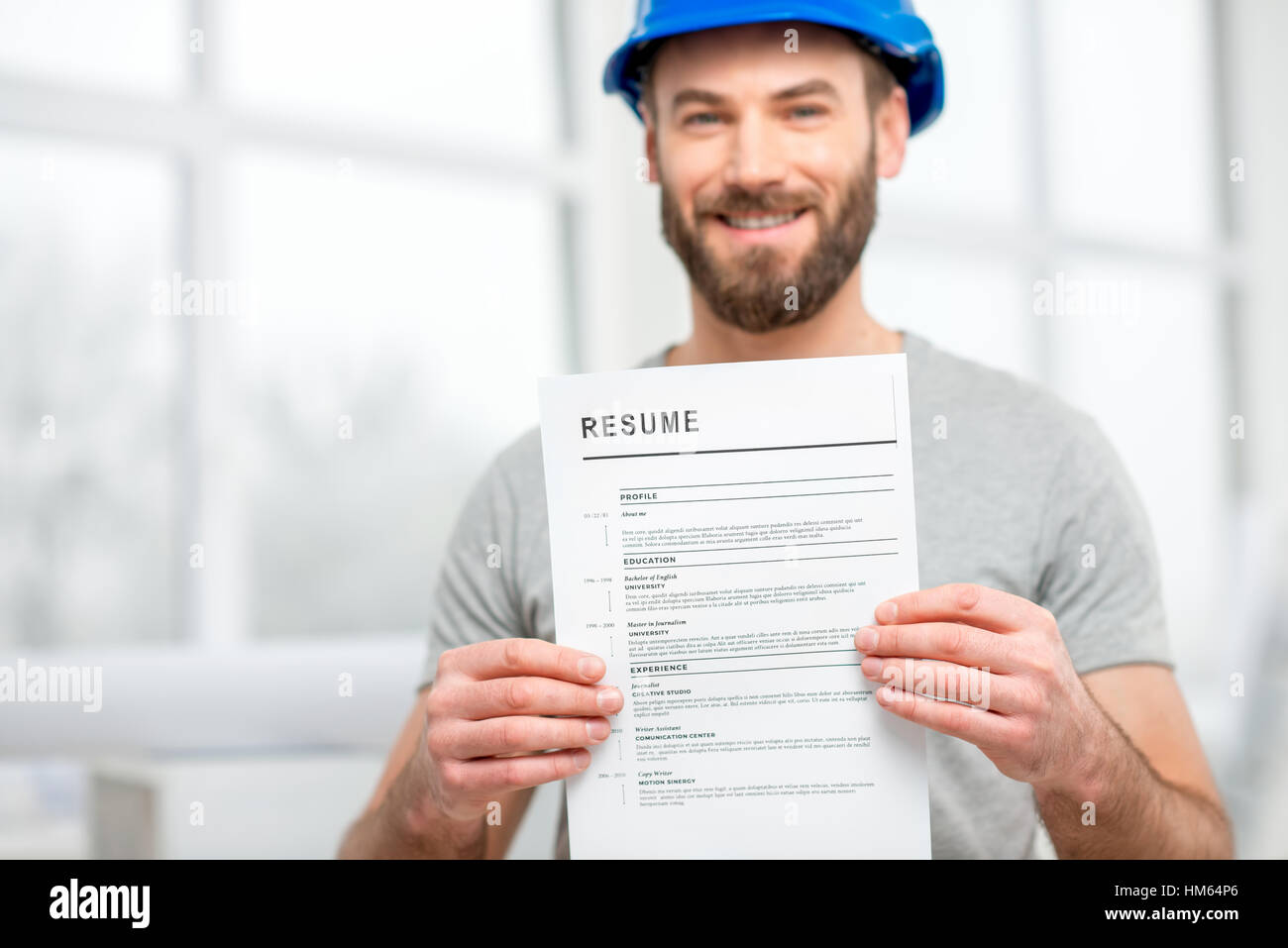 Builder searching a job Stock Photo - Alamy