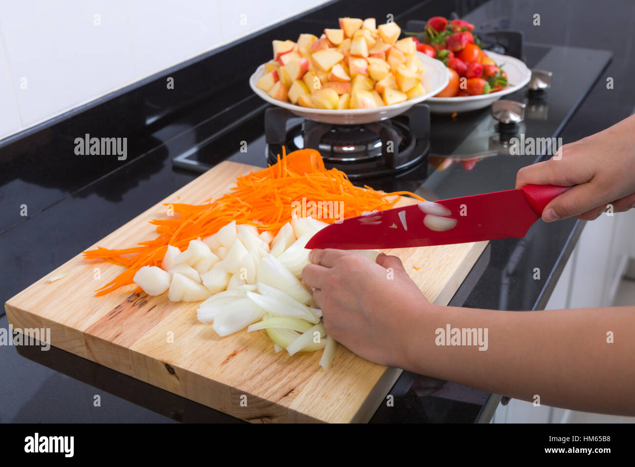 Cooking vegetables and fruit salad in kitchen Stock Photo - Alamy