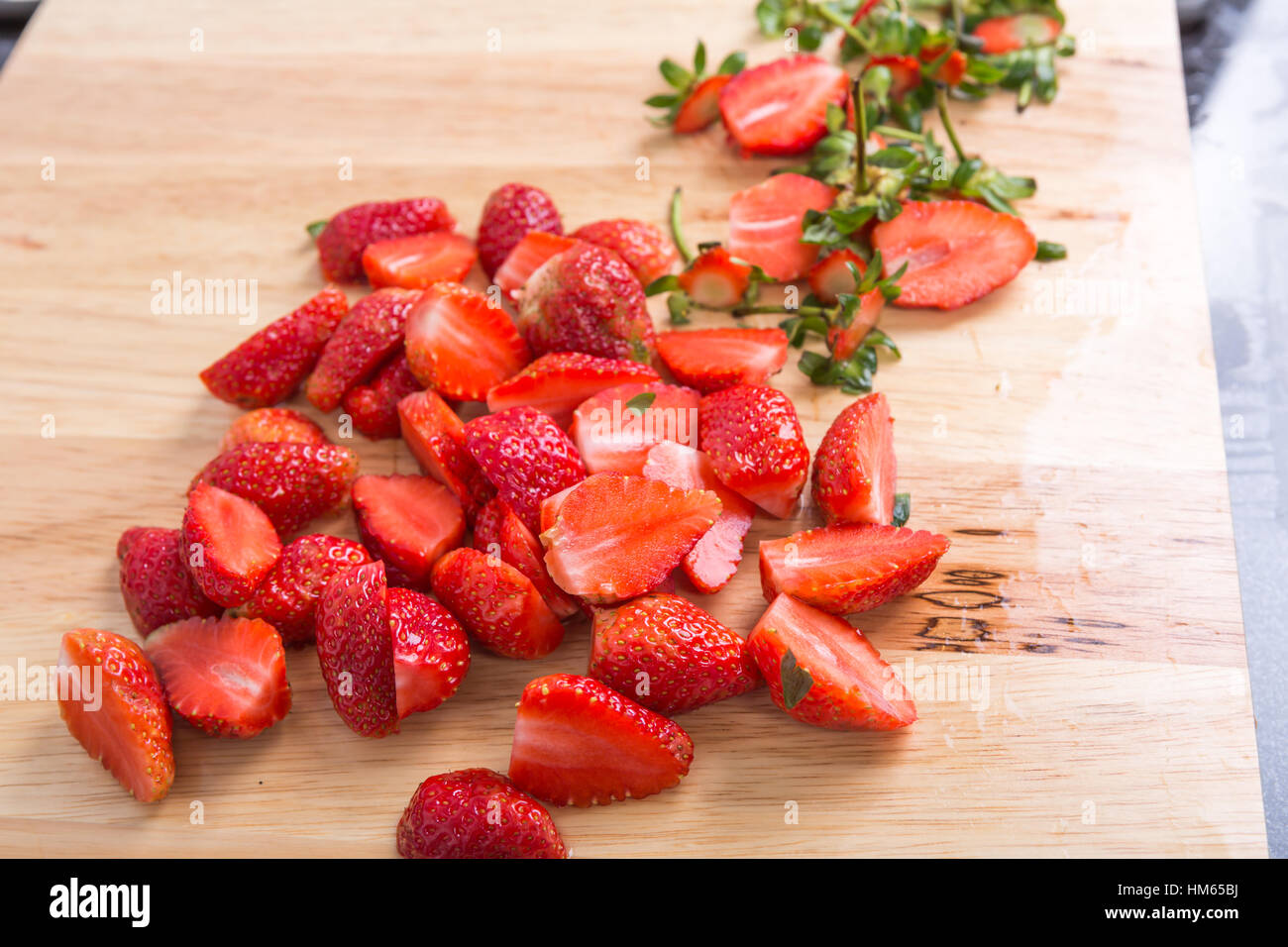 Fresh strawberries cut into pieces Stock Photo - Alamy