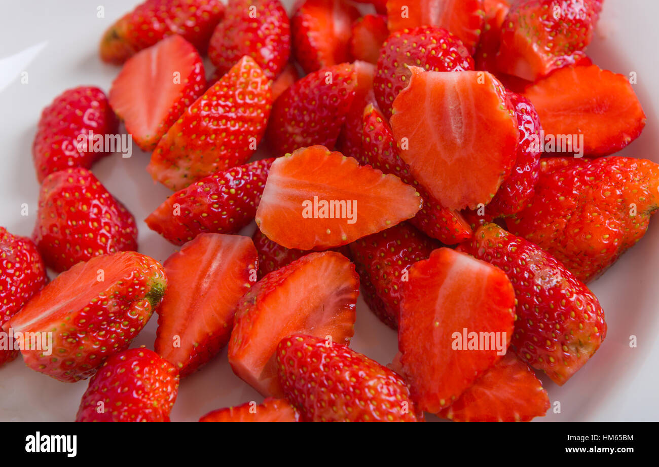 Fresh strawberries cut into pieces Stock Photo - Alamy