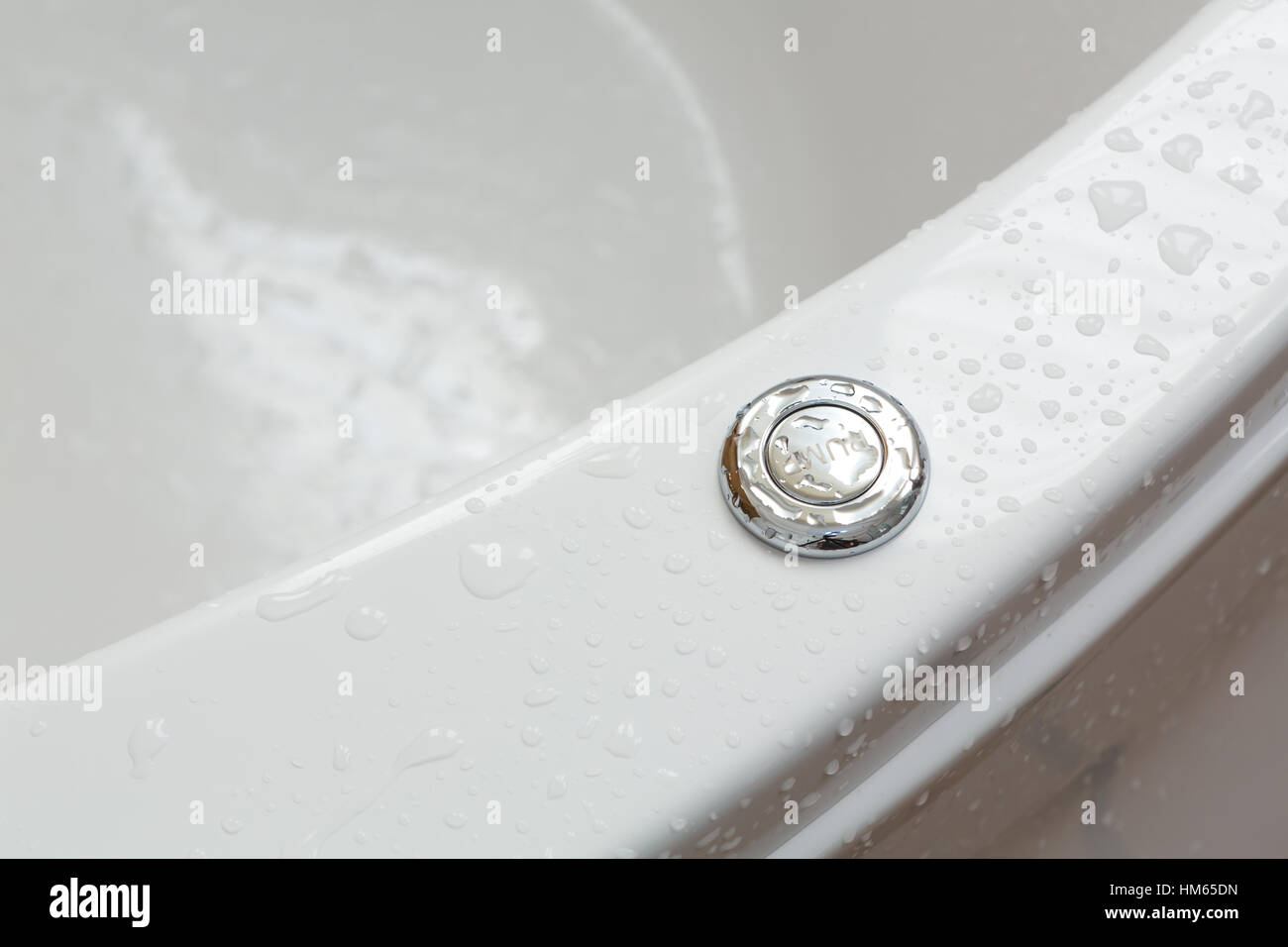 Pump button of Jacuzzi in bathroom Stock Photo - Alamy