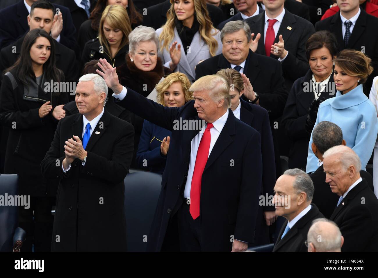 President-elect Donald Trump waves standing with Vice President elect ...