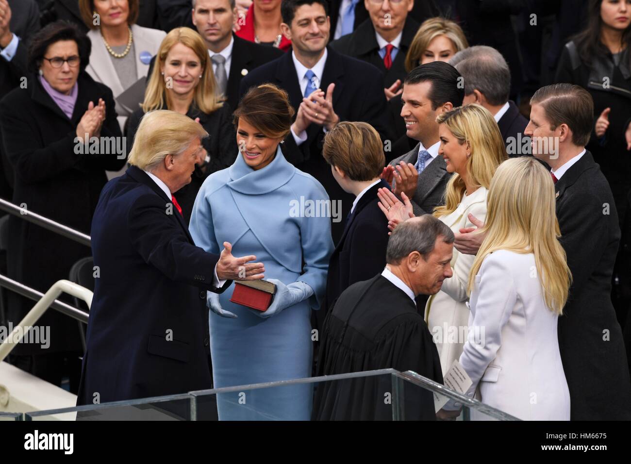 President Donald Trump turns for a group hug from his wife and children ...