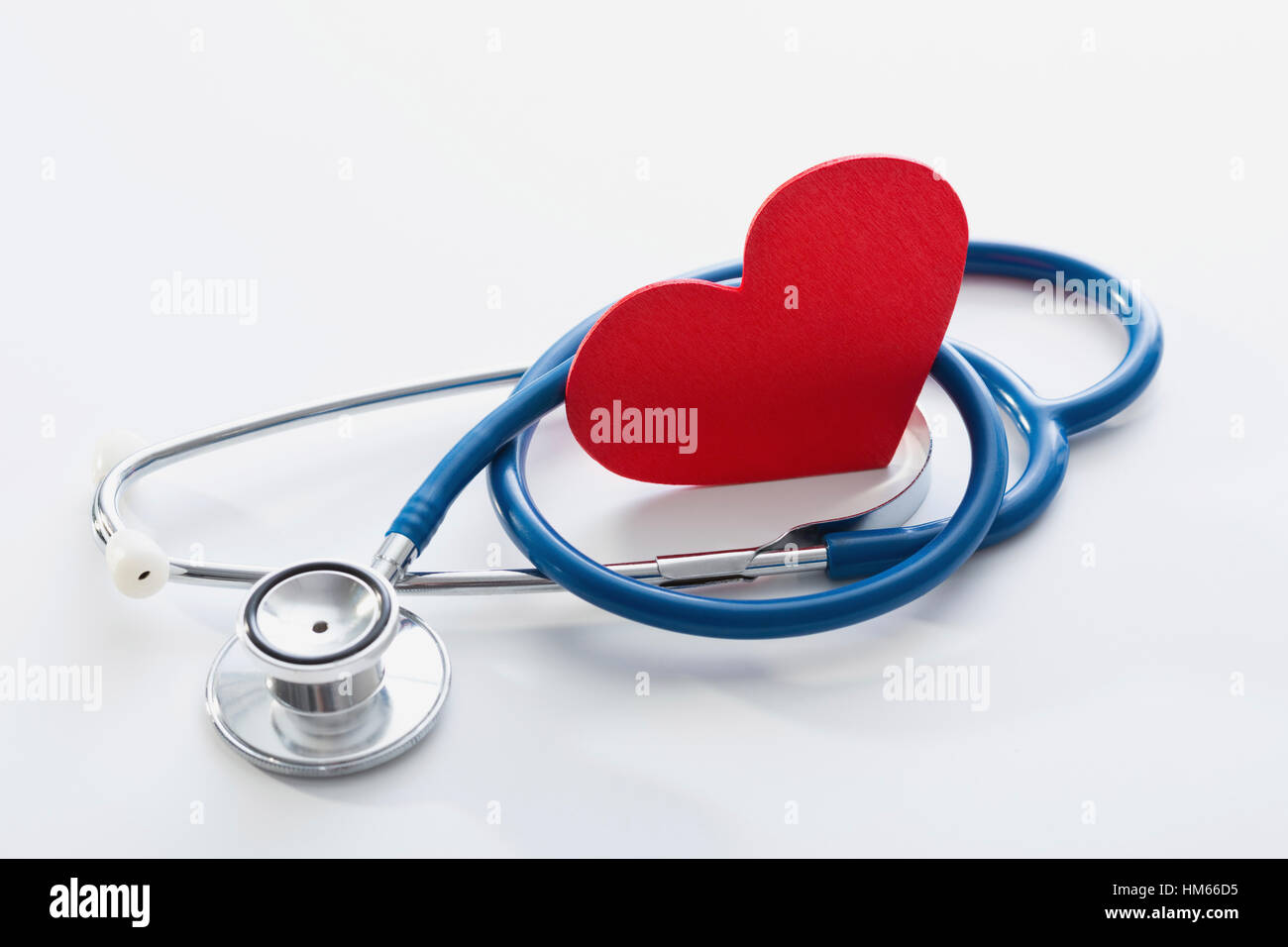 Stethoscope and red heart on white surface Stock Photo - Alamy